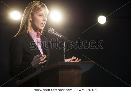 charity_stock-photo-young-businesswoman-giving-speech-at-podium-in ...